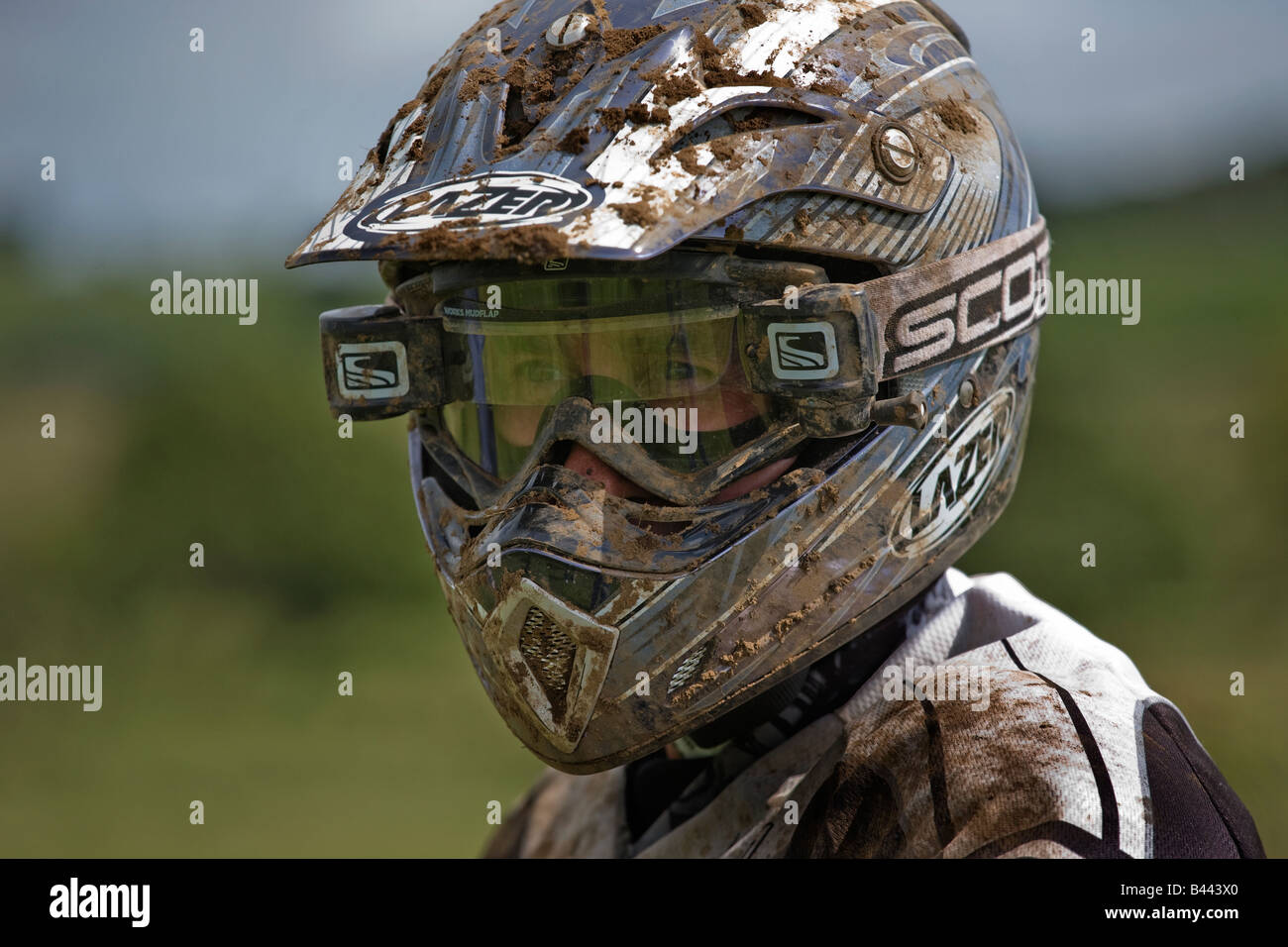 Man with crash helmet involved in motocross racing, racing circuit ...
