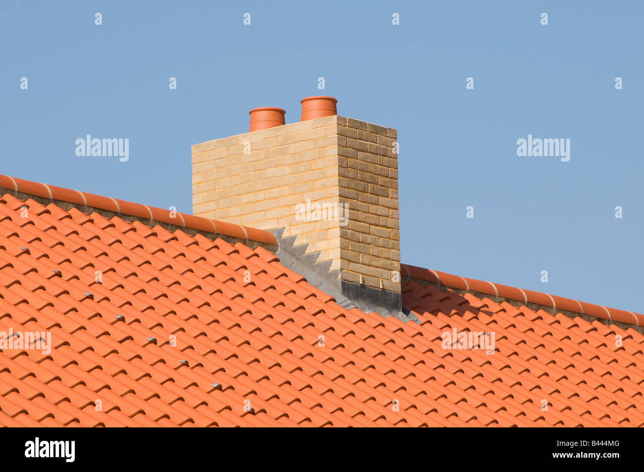 brick chimney stack and roof tiles on modern house Stock Photo - Alamy