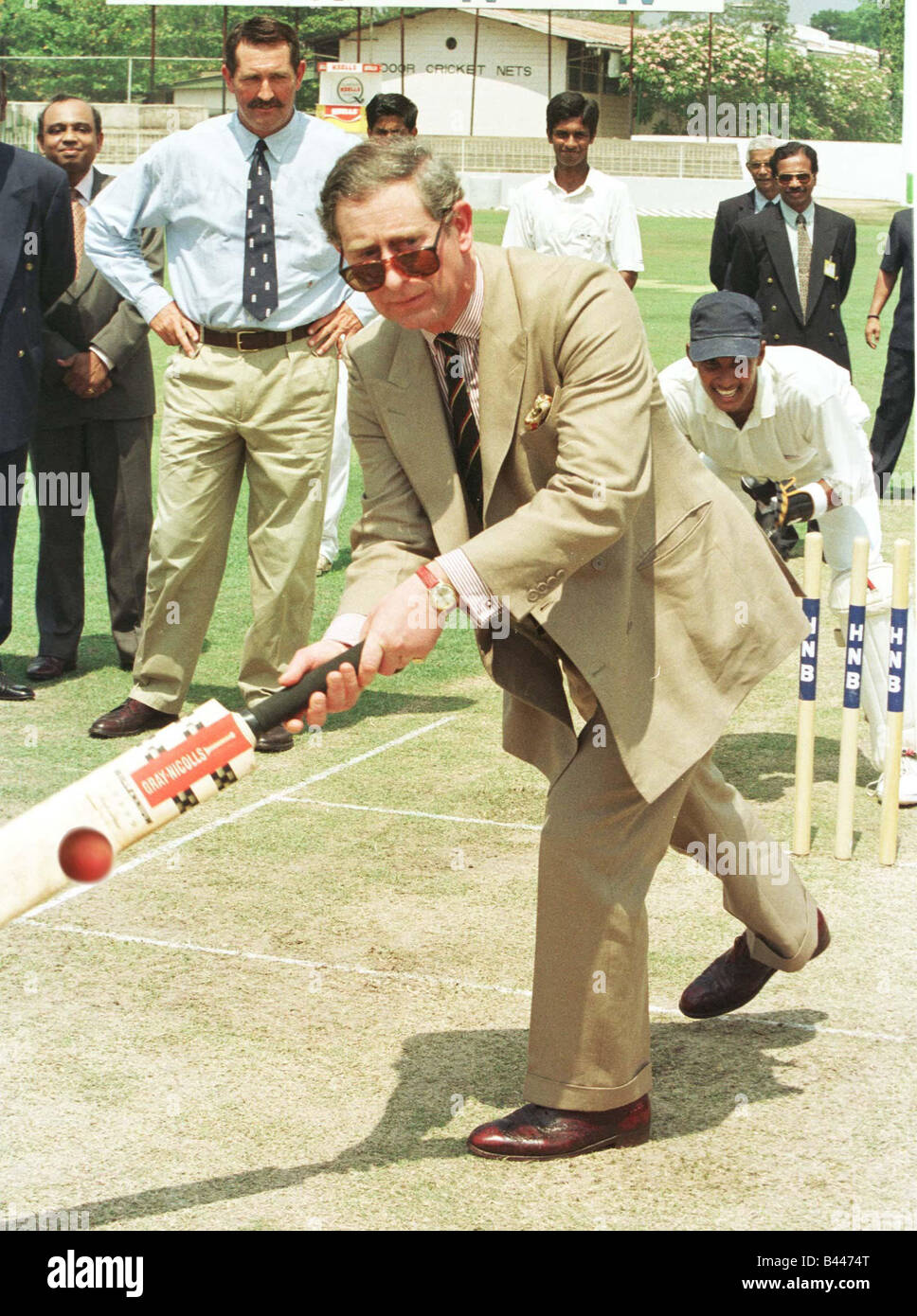 Prince Charles playing cricket in Sri Lanka on a state visit watched by ...