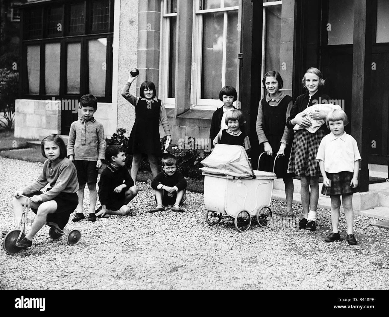 Children evacuated from Glasgow during World War Two play in a garden ...