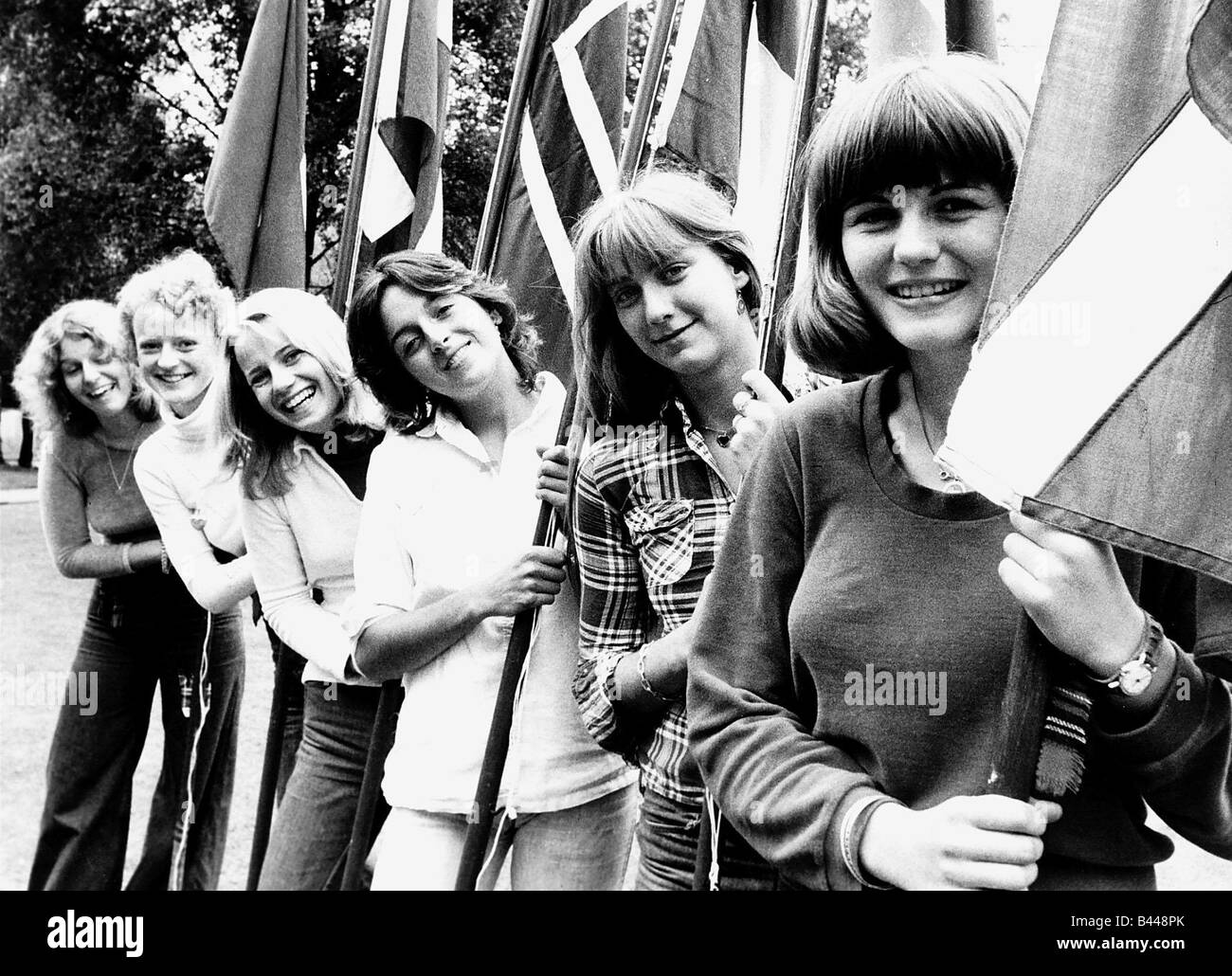 Teenagers at the YMCA camp at Aberfeldy Perthshire holding flags to ...