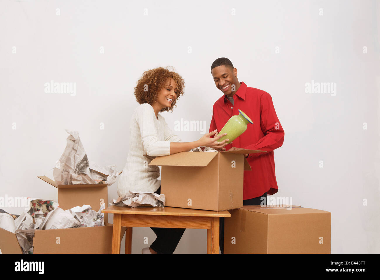 African Couple Unpacking Moving Boxes Stock Photo Alamy