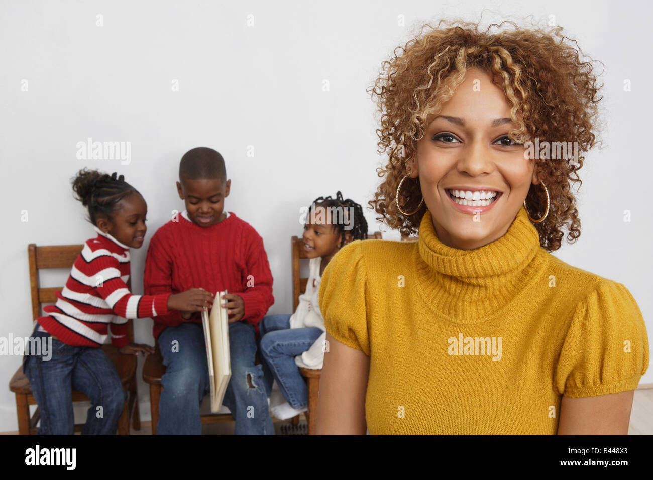 African mother in front of children Stock Photo - Alamy