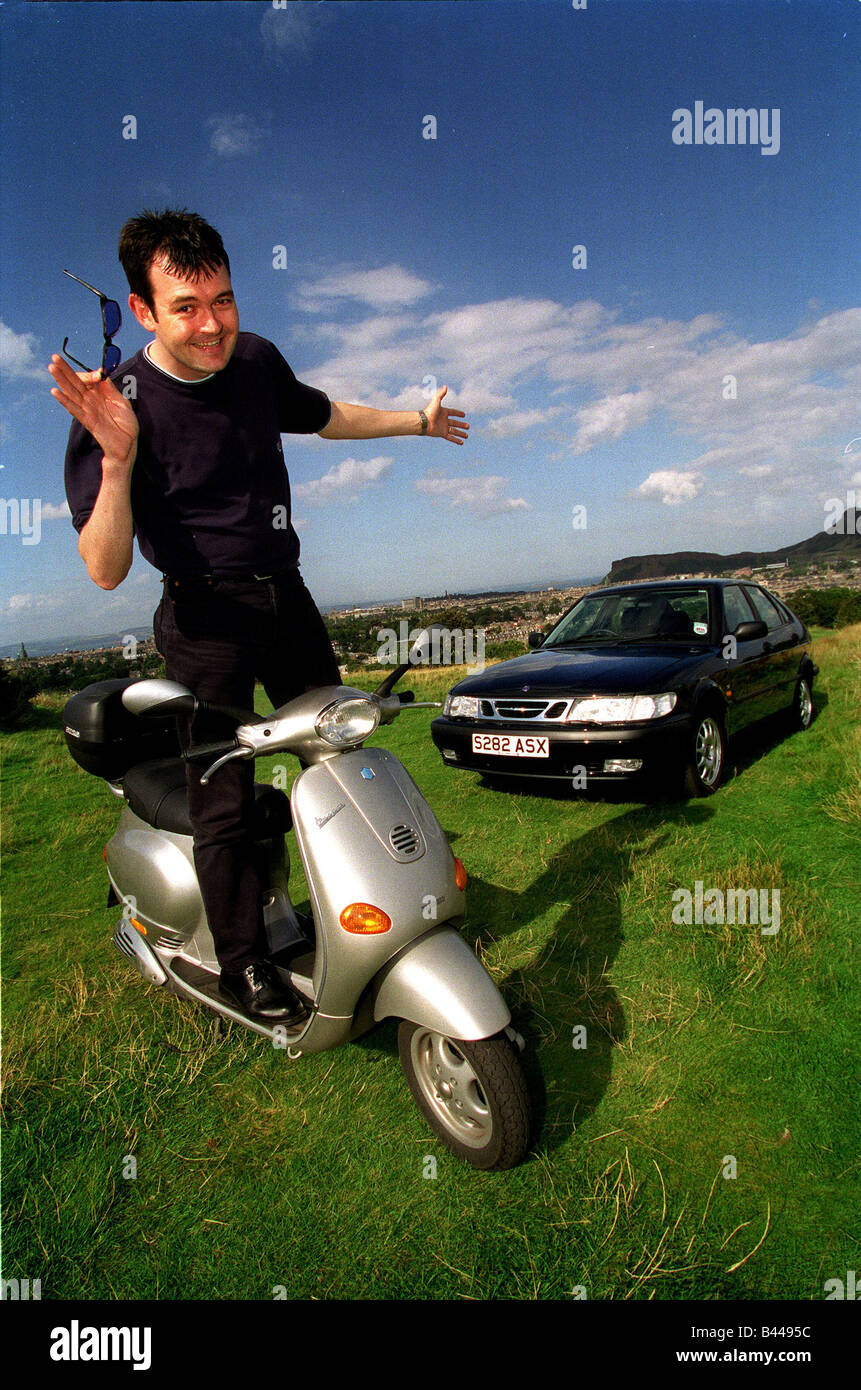 Grant Stott standing on Vespa scooter September 1998 Stock Photo - Alamy