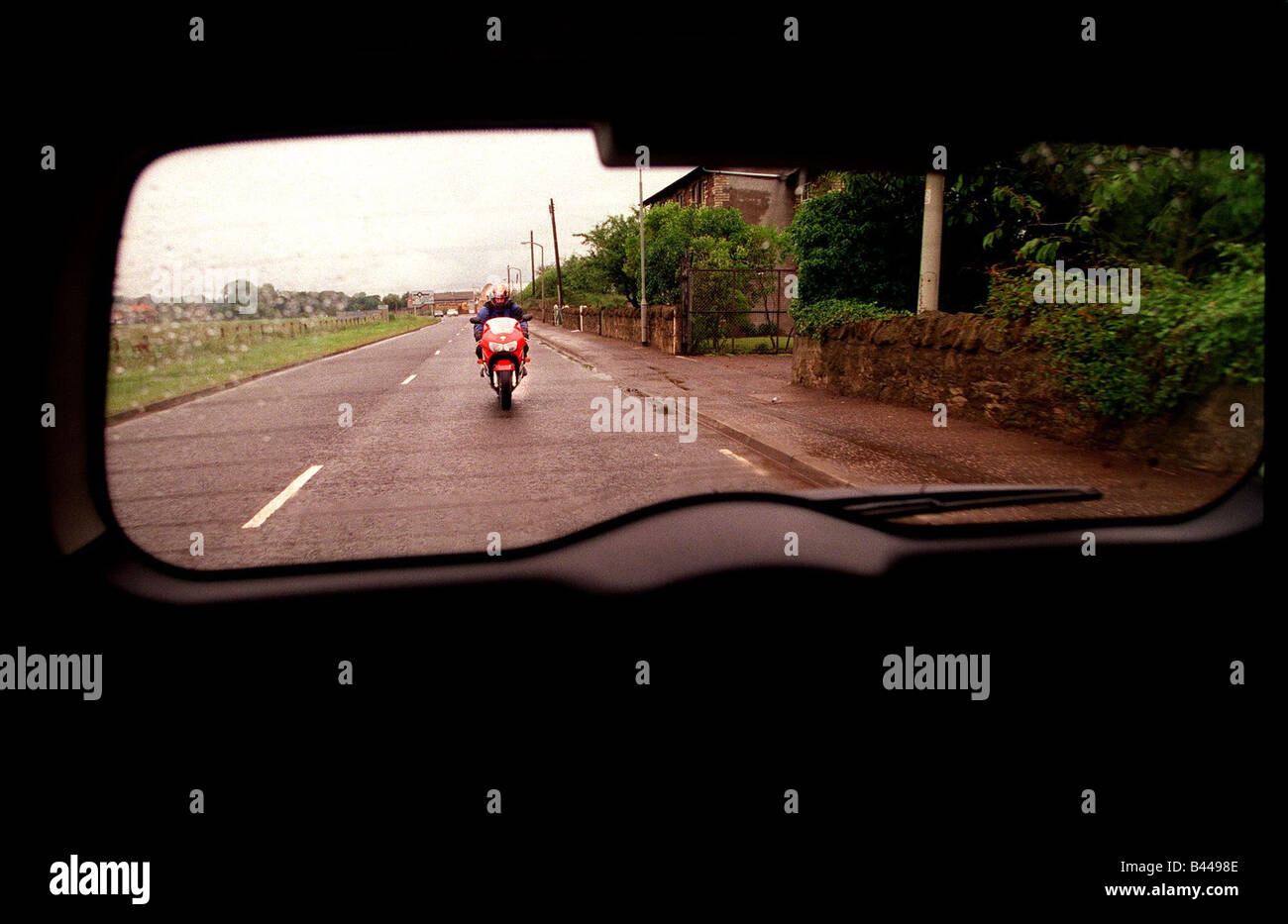 Green Vauxhall Astra van July 1999 with red Honda motorbike Stock Photo ...