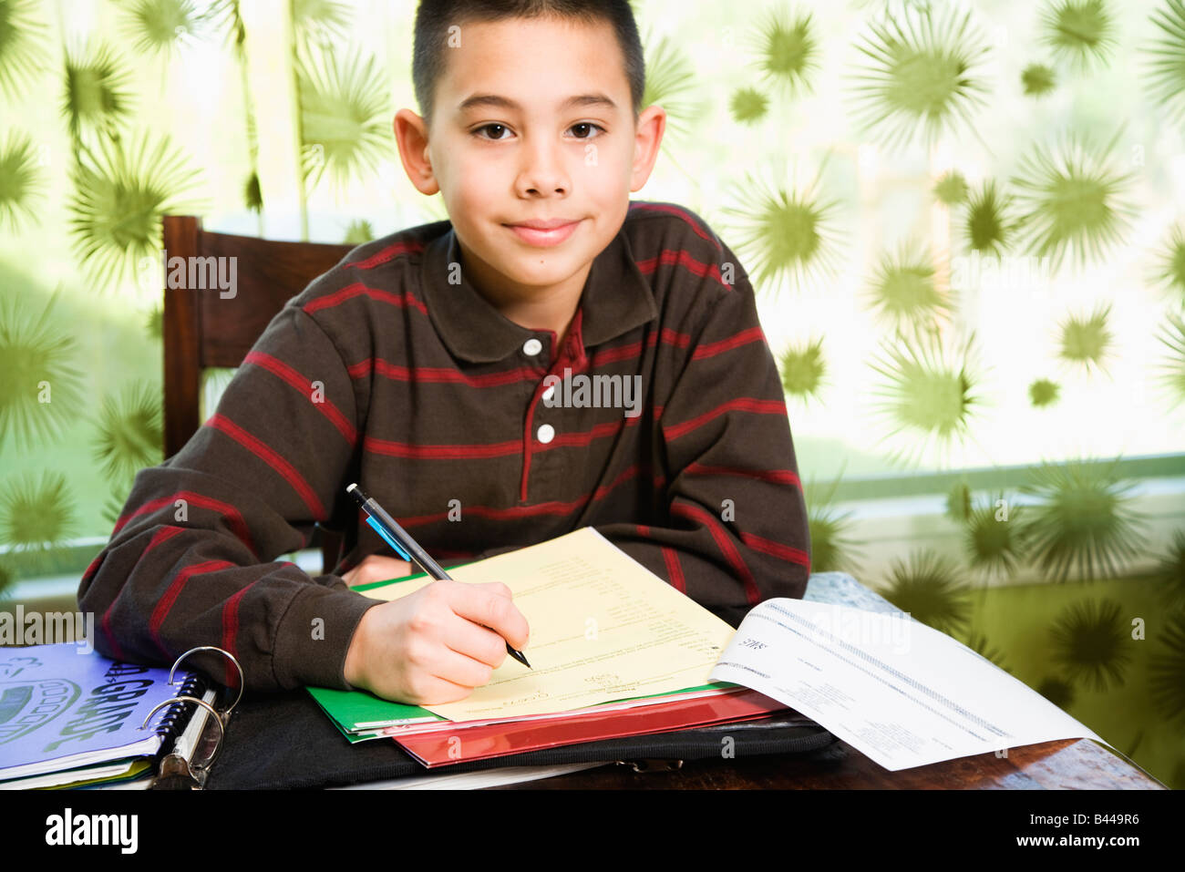 Asian boy doing homework Stock Photo - Alamy