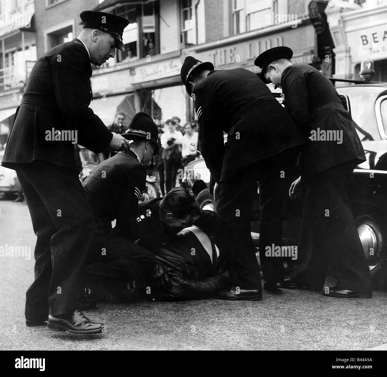 Rockers youth culture police arresting a rocker Stock Photo - Alamy