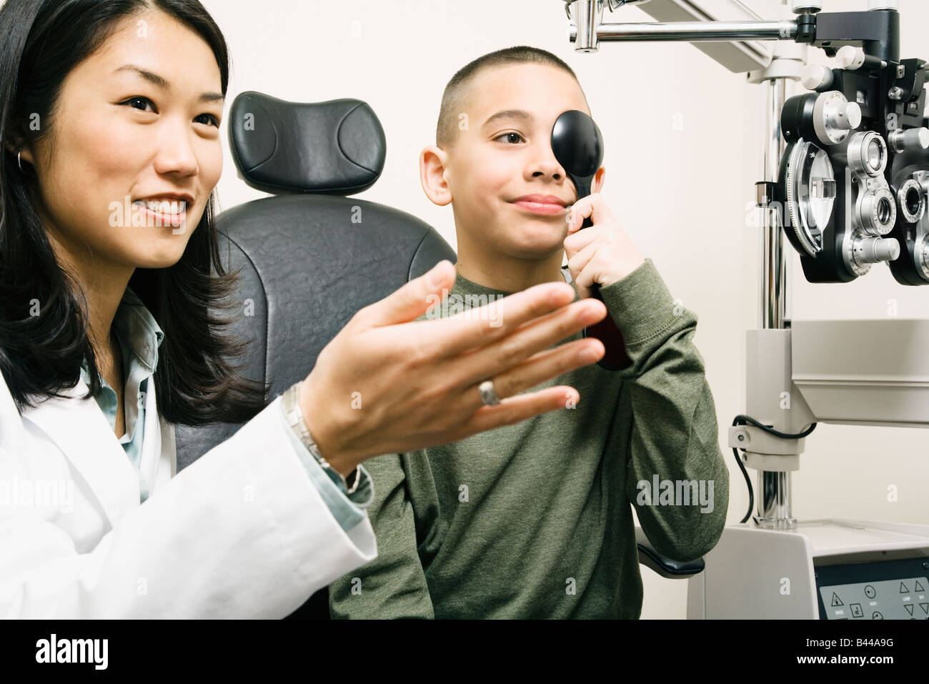 Ophthalmologist examining vision pre hi-res stock photography and ...