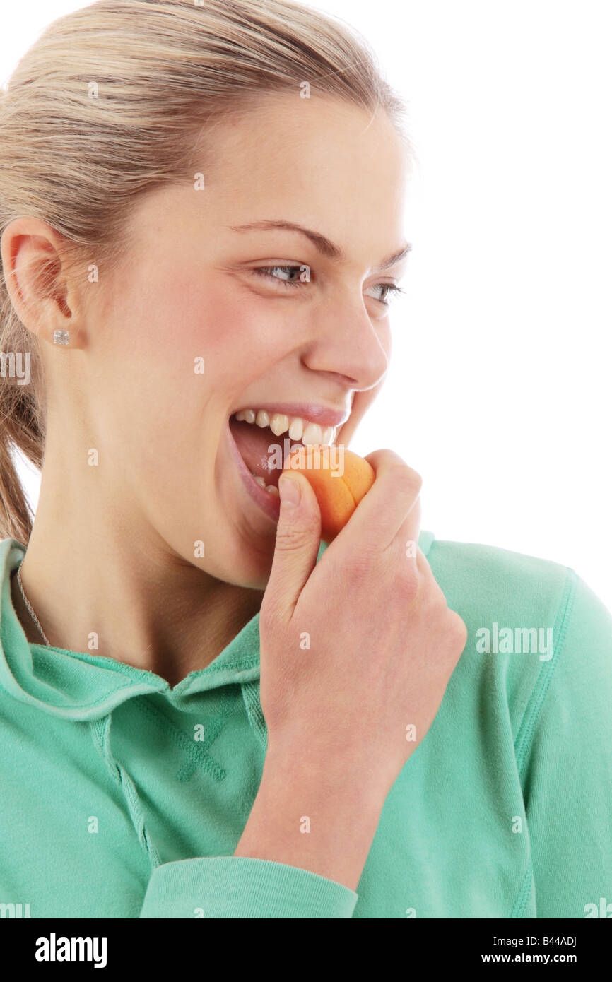 Young Woman Eating Apricot Model Released Stock Photo - Alamy