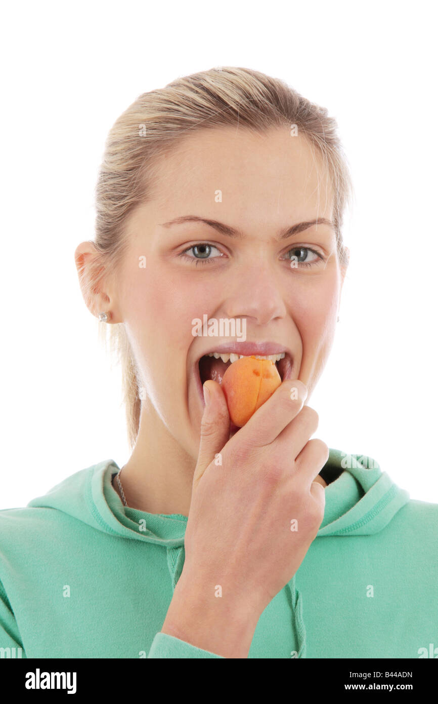 Young Woman Eating Apricot Model Released Stock Photo - Alamy