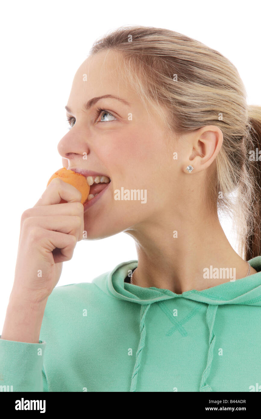 Young Woman Eating Apricot Model Released Stock Photo - Alamy