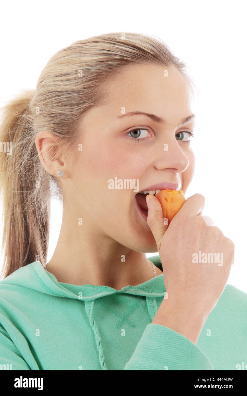 Young Woman Eating Apricot Model Released Stock Photo - Alamy
