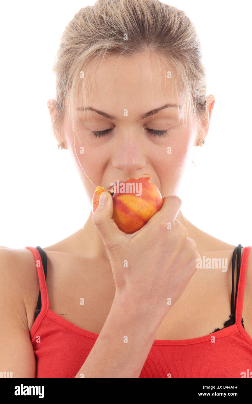 Young Woman Eating Nectarine Model Released Stock Photo - Alamy