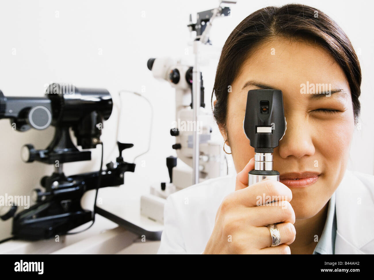 Woman covering eye test hi-res stock photography and images - Alamy