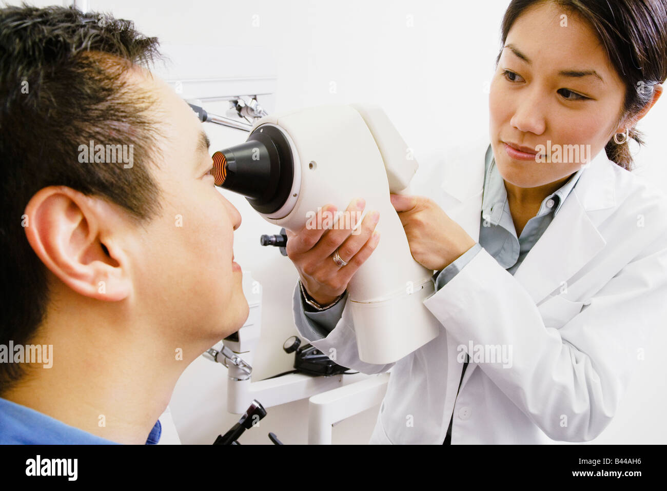 Close up optometrist examining patient hi-res stock photography and ...
