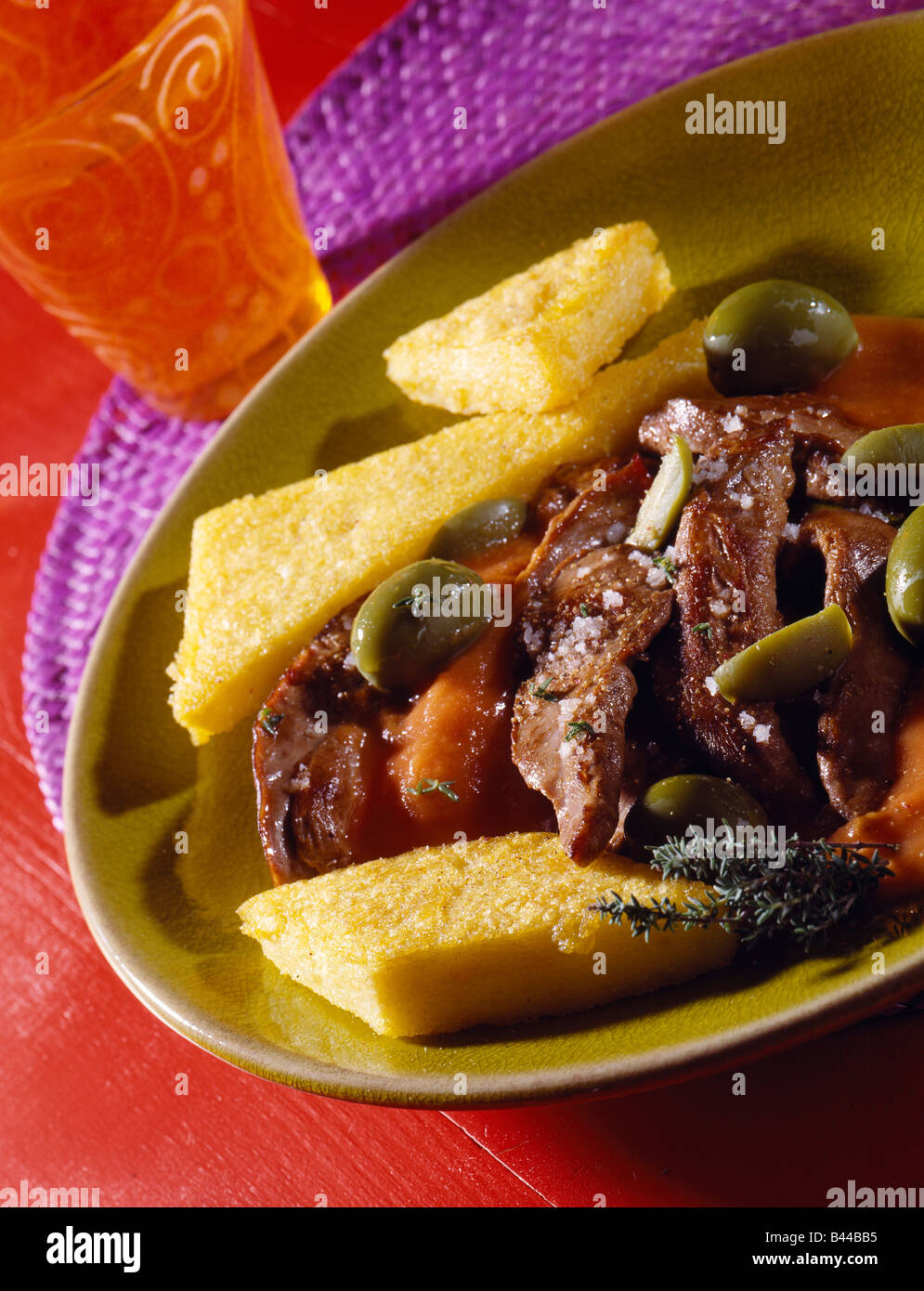 Sauteed duck fillet and olives Stock Photo - Alamy