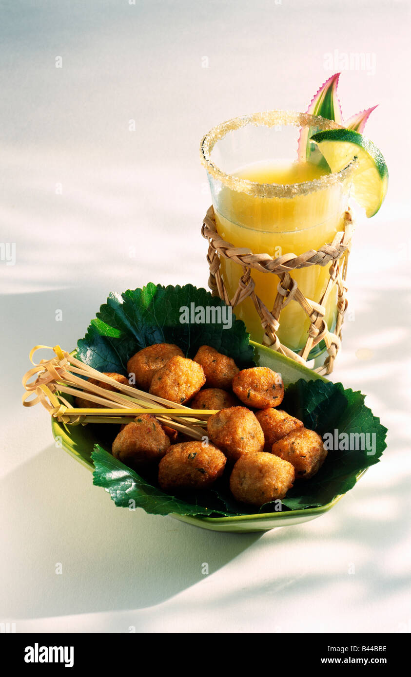 Pineapple Creole punch and small cod accras Stock Photo - Alamy