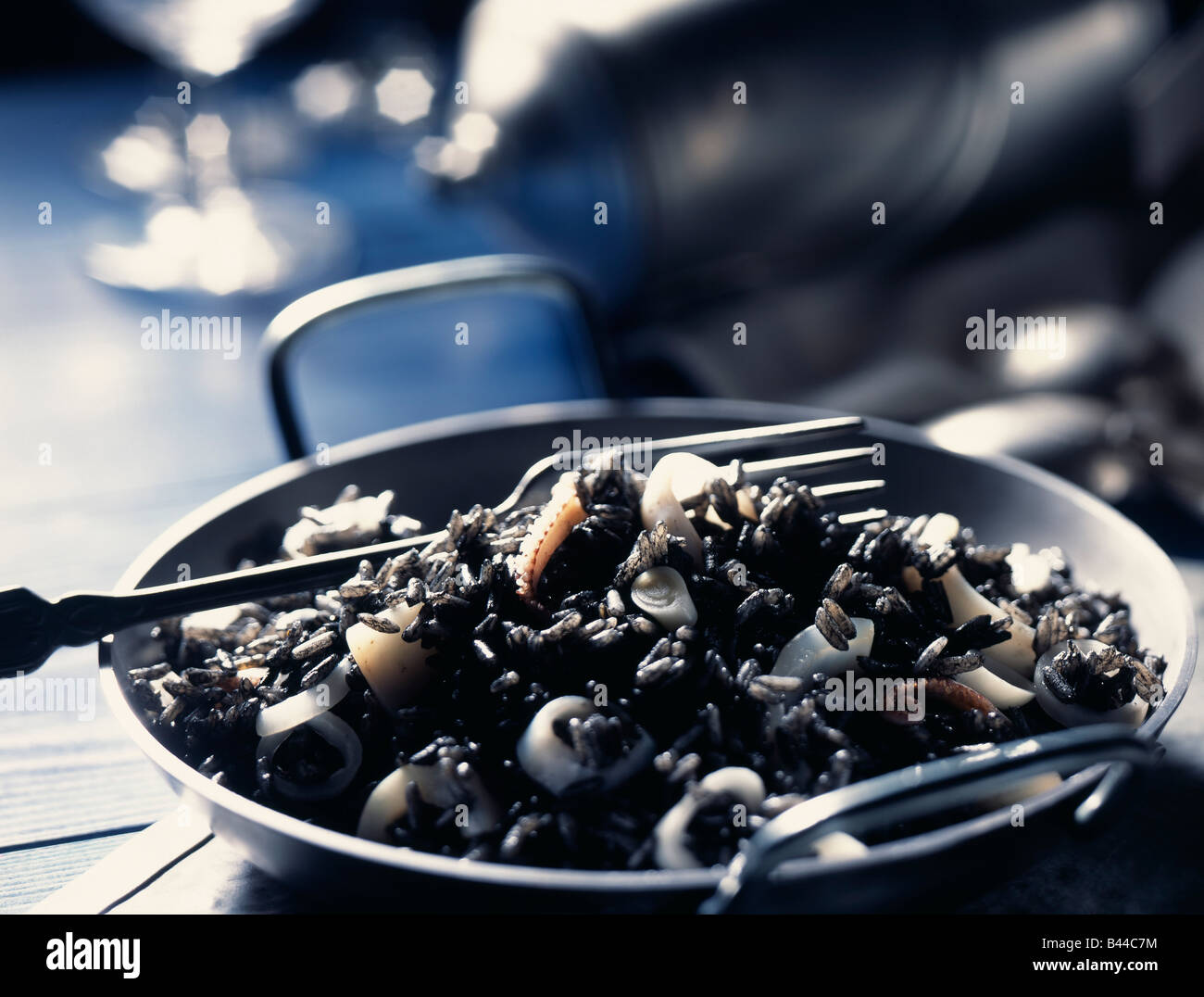 Rice with squid and squid ink sauce Stock Photo - Alamy