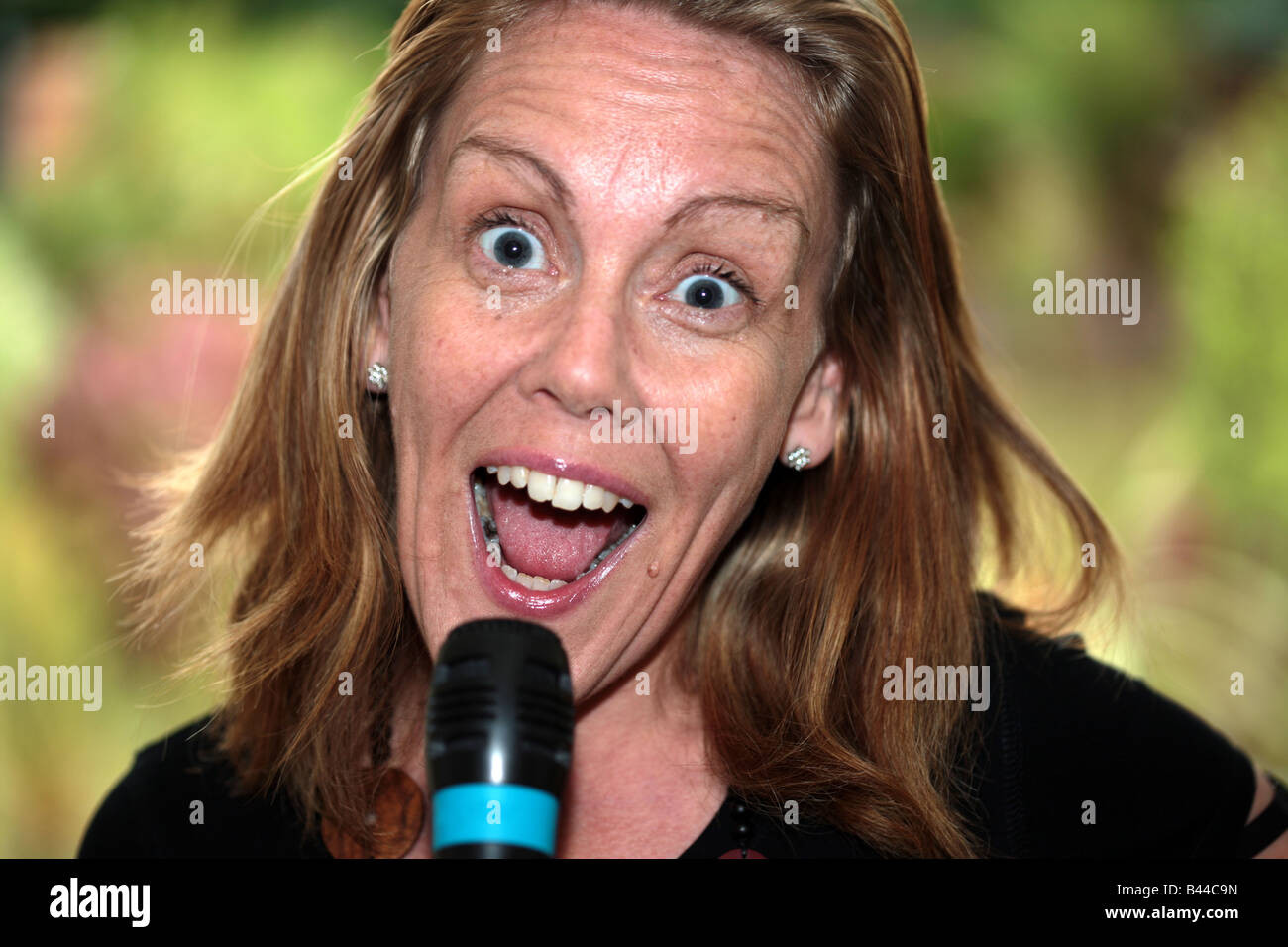 Woman singing audition hi-res stock photography and images - Alamy