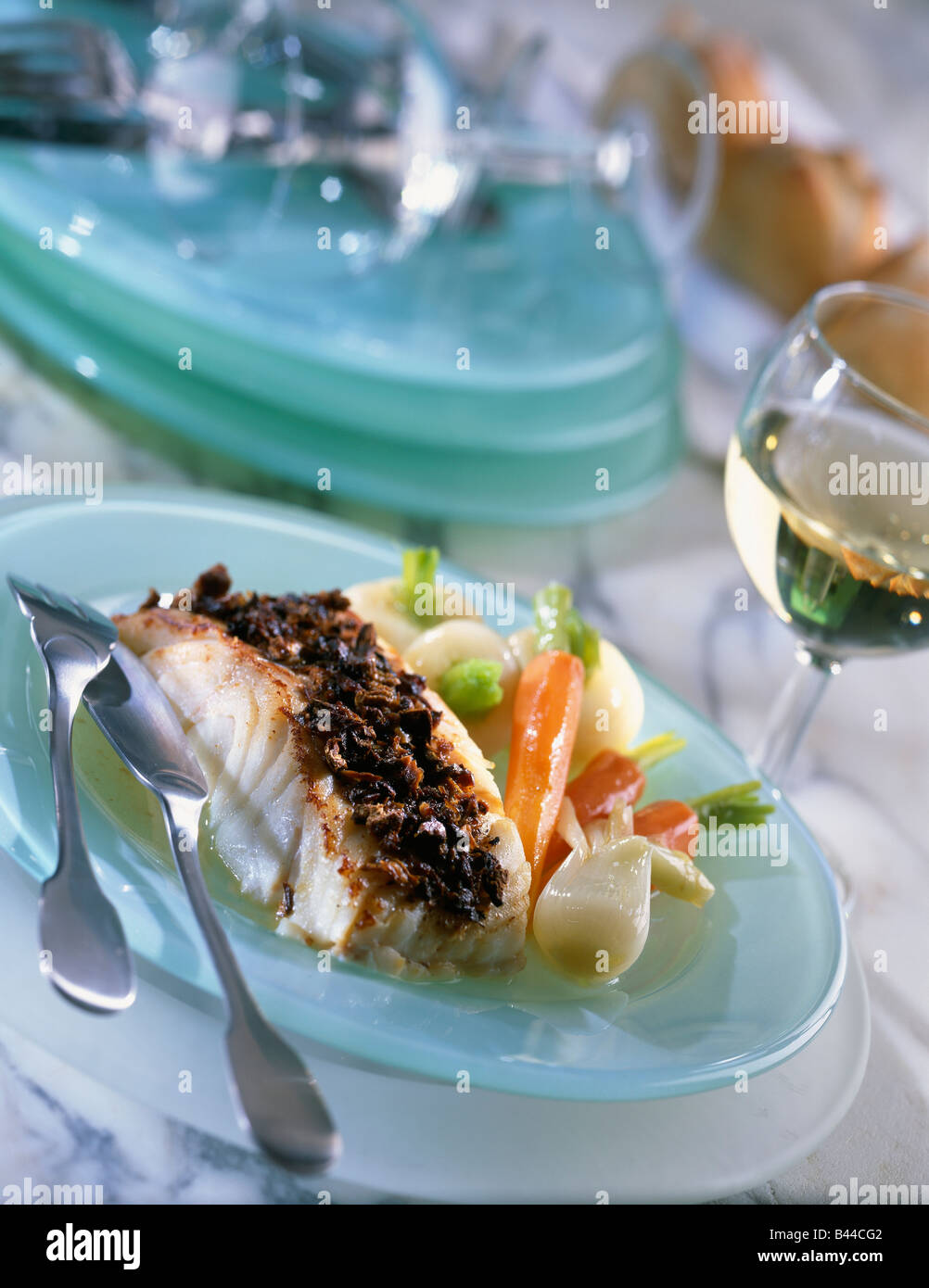 Piece of cod with cooking tobacco and vegetables Stock Photo - Alamy