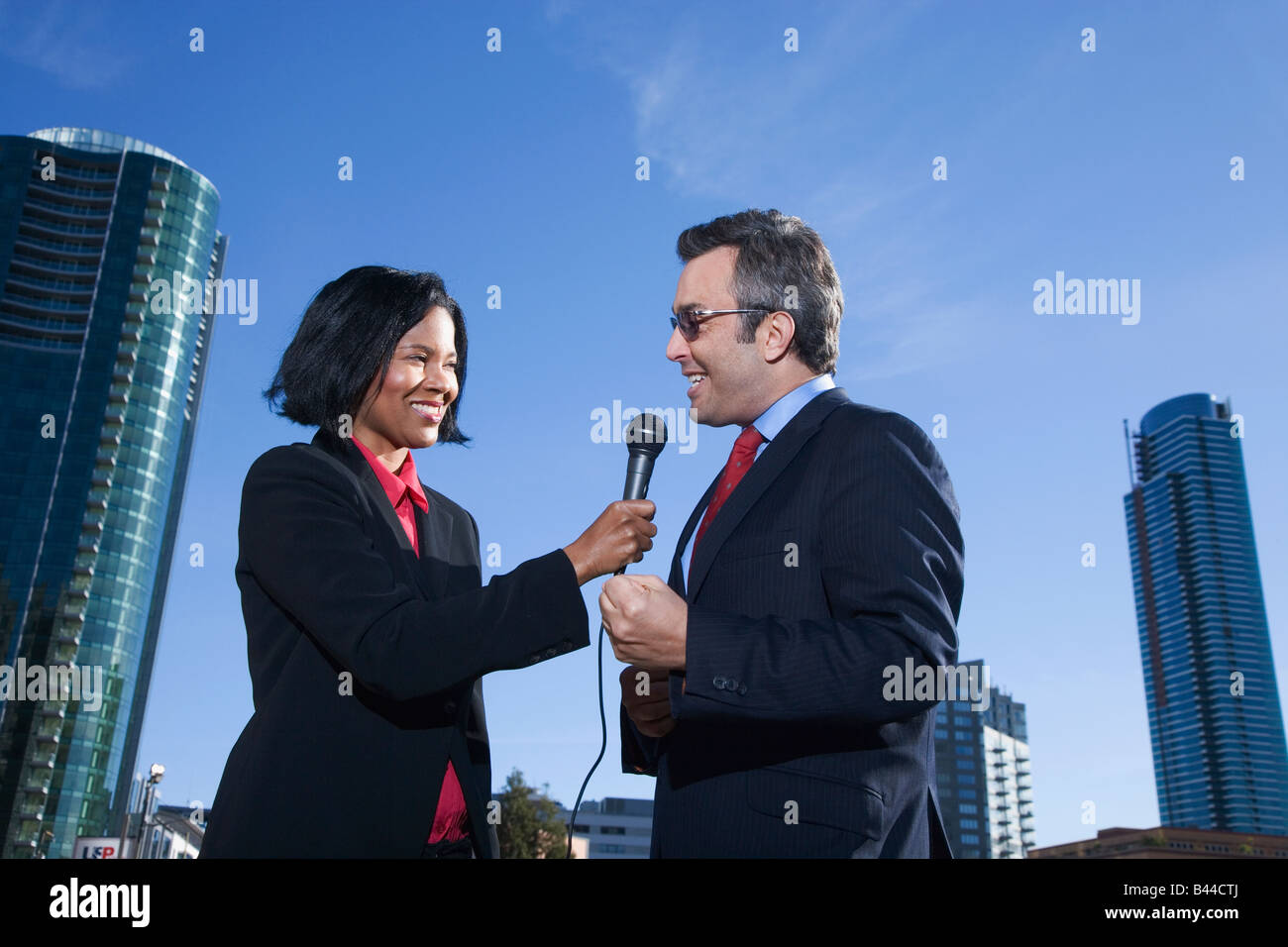 Female Reporter Interviewing Woman High Resolution Stock Photography ...