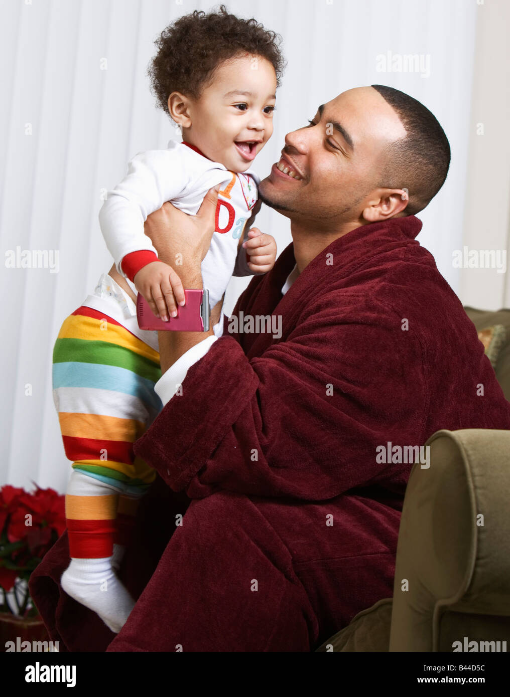 African father smiling at baby Stock Photo - Alamy