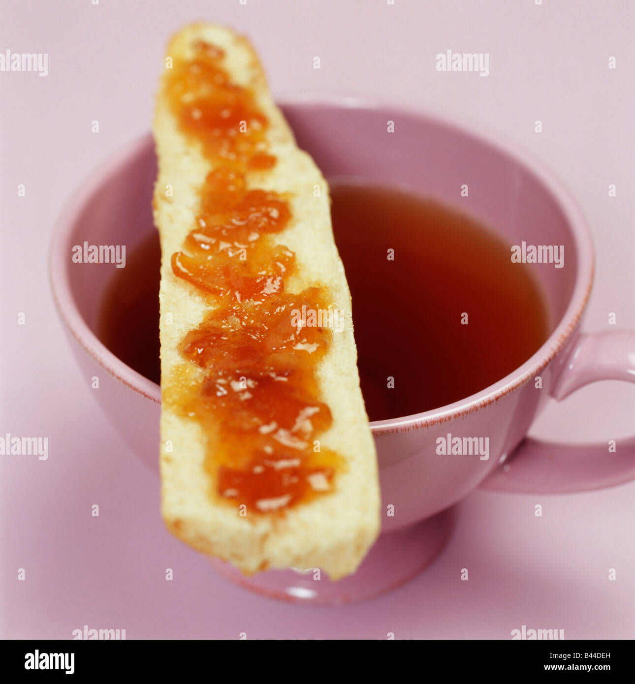 jam on baguette with bowl of tea Stock Photo - Alamy