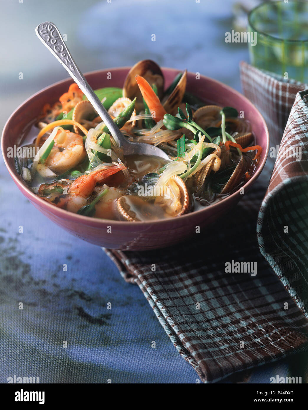 Spicy broth with soya vermicelli and shellfish Stock Photo - Alamy