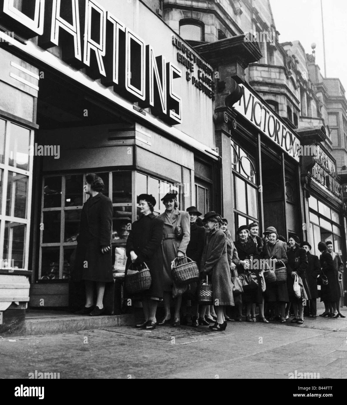 WW2 First Queue of the day people wait for hot bread Stock Photo - Alamy