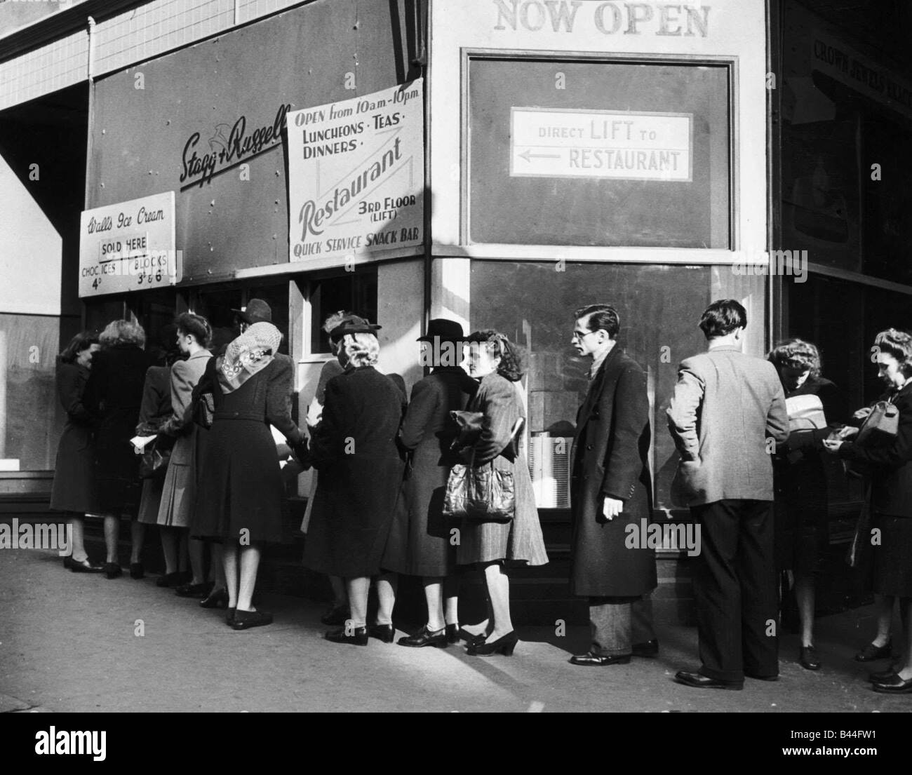 People queing up hi-res stock photography and images - Alamy