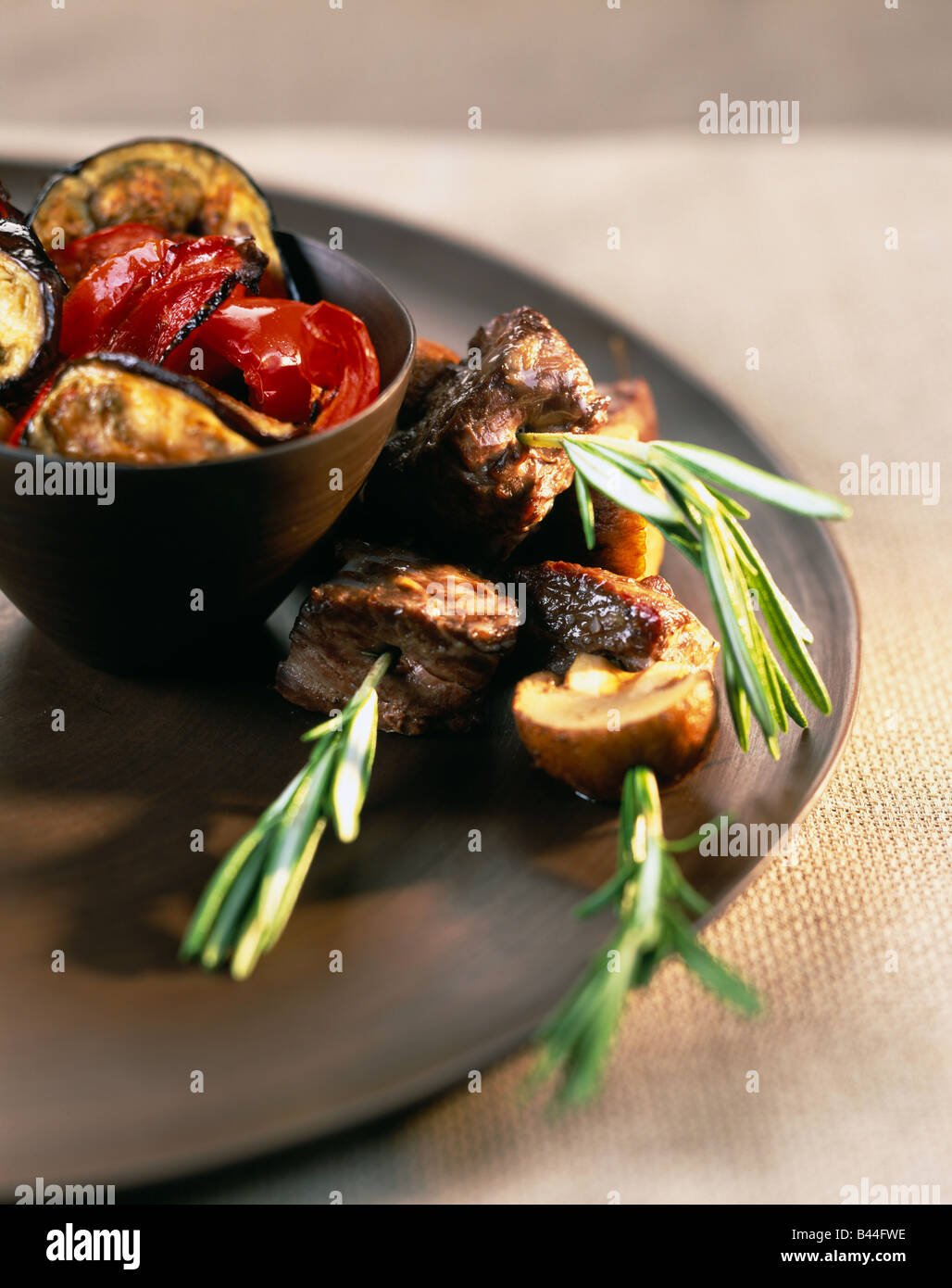 Beef brochettes with grilled vegetables Stock Photo - Alamy
