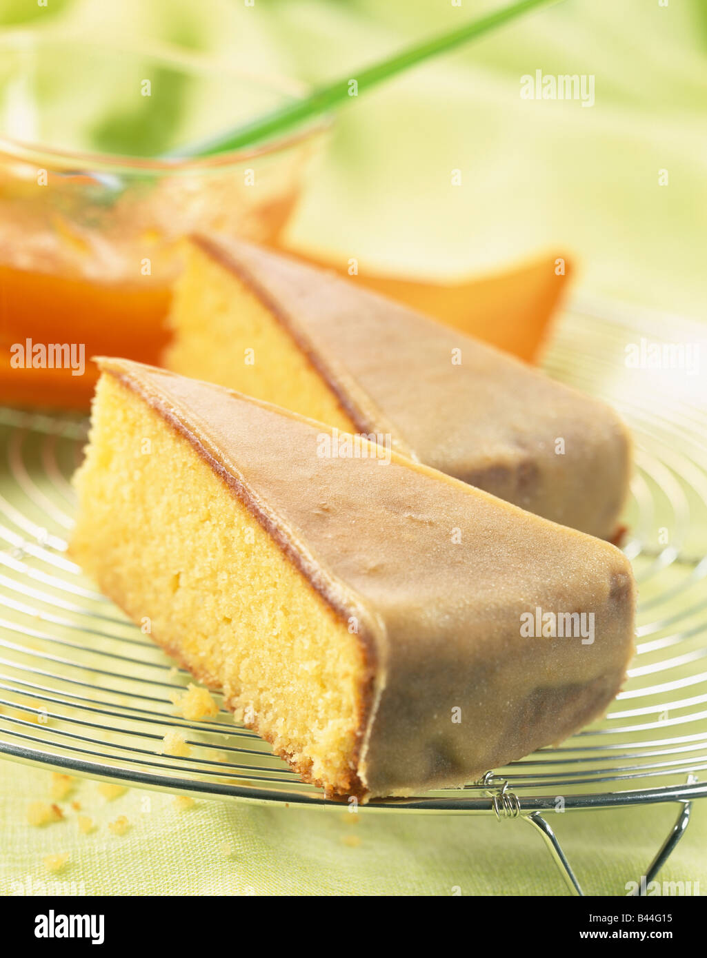 Sponge cake with apricot icing Stock Photo - Alamy