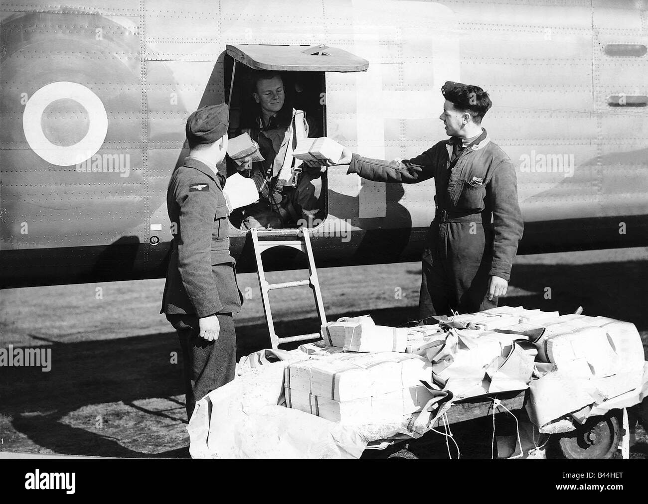 British airmen load bomber with propoganda leaflets to be dropped on ...