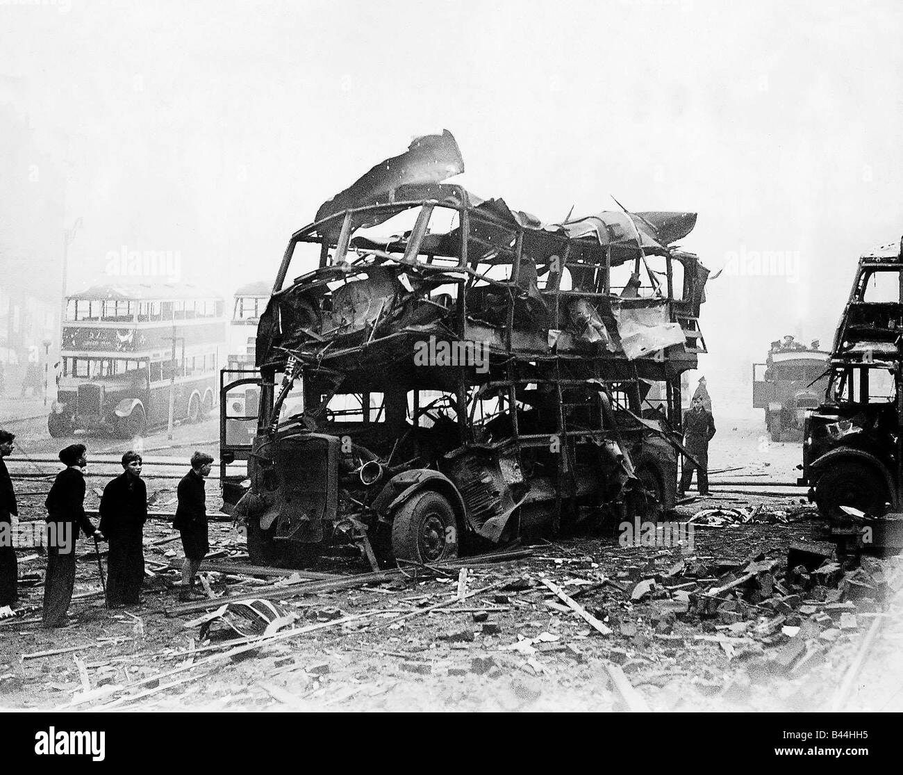 Double decker bus caught in the blast from a bomb during an air raid on ...