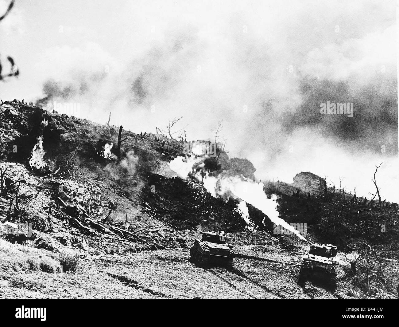 A US Army flame throwing tank in action against Japanese positions at ...