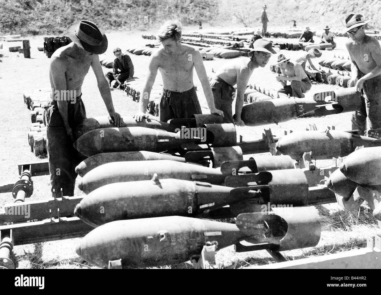 RAF ground crew in Burma loading 250lb bombs on to loading trolleys at ...