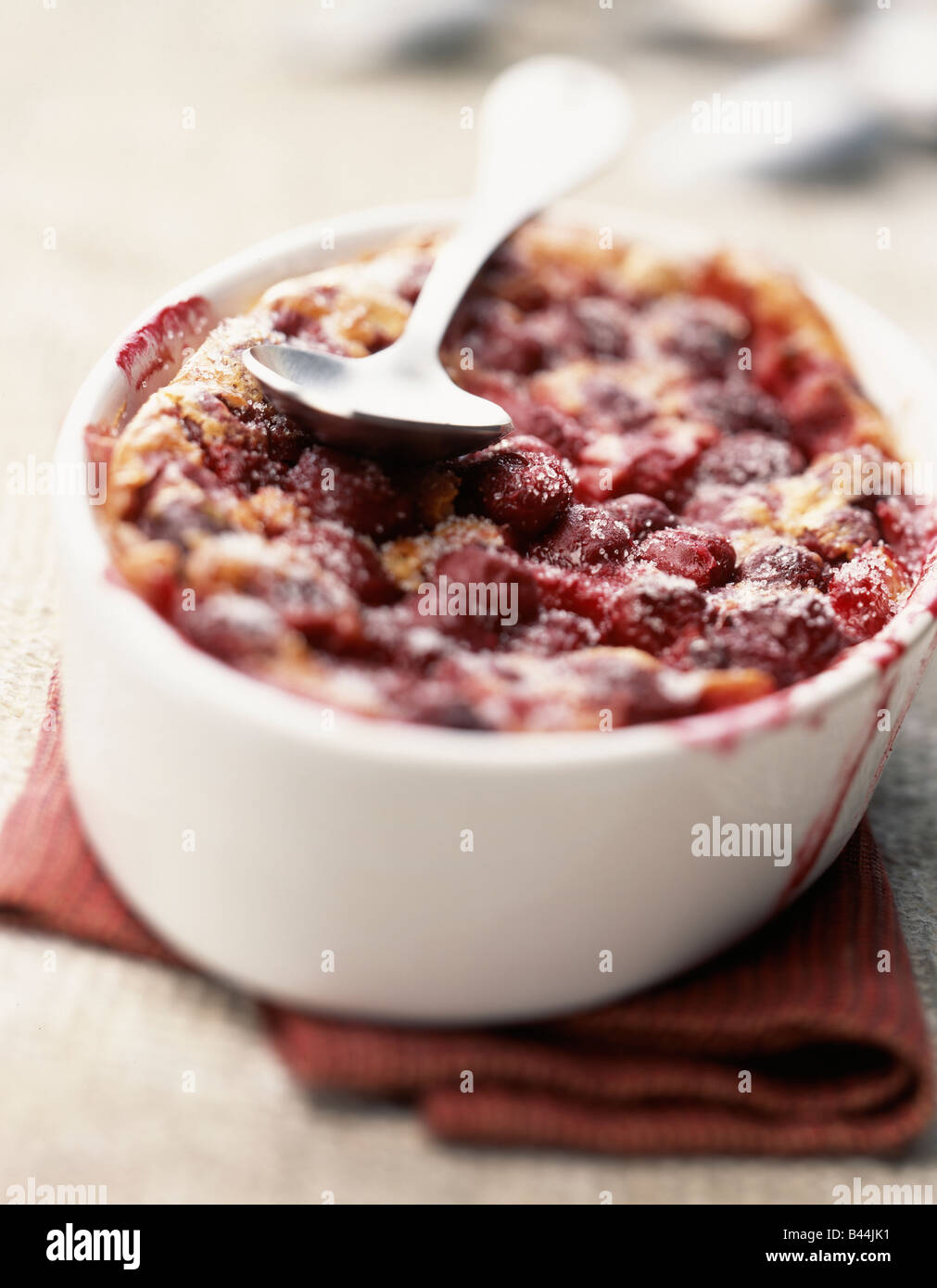 cherry clafoutis batter pudding Stock Photo - Alamy