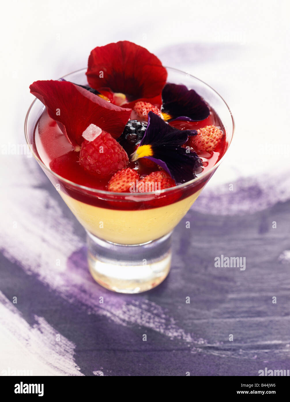 Acidic salad with passion fruit, summer fruit and pansy Stock Photo - Alamy