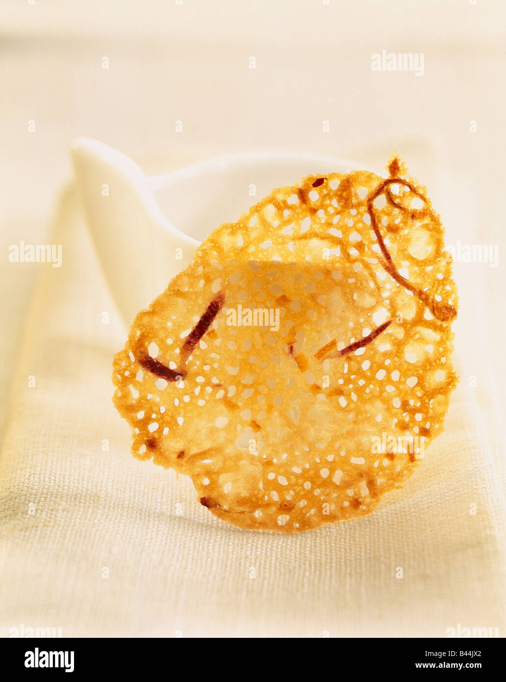 Orange and hibiscus tuile biscuit Stock Photo - Alamy