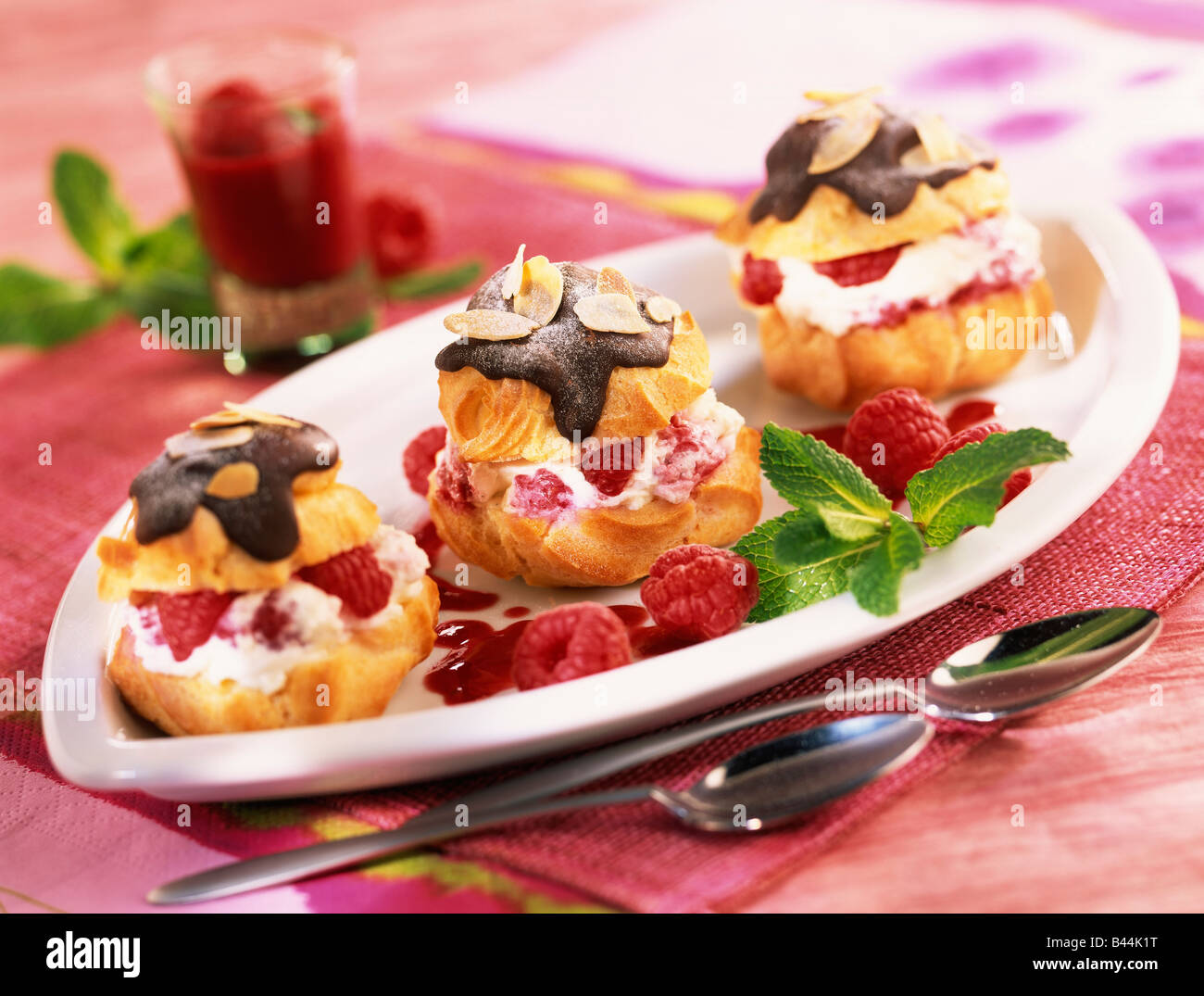 Profiteroles filled with chocolate mousse hi-res stock photography and ...