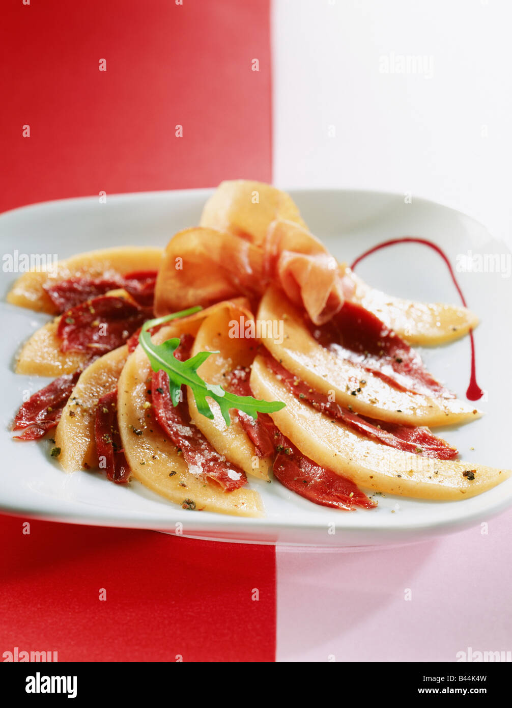 Raw ham,melon and duck fillet carpaccio Stock Photo - Alamy