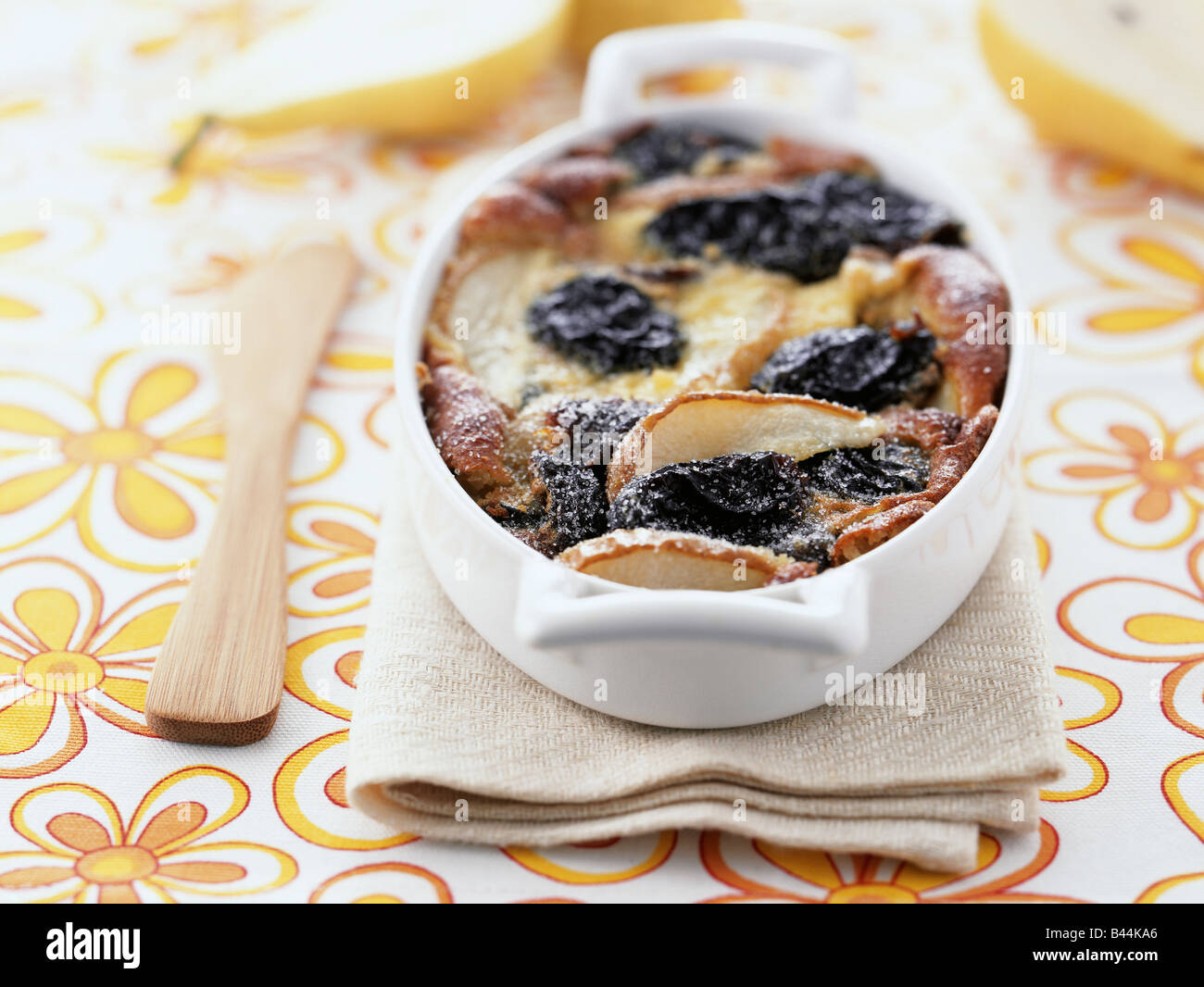 pear and prune clafoutis batter pudding Stock Photo - Alamy