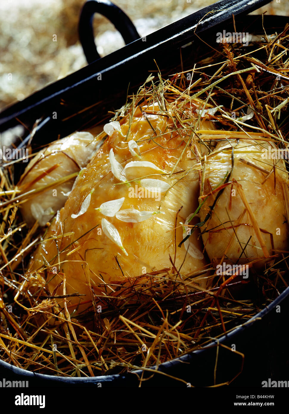 Chicken cooked with hay Stock Photo - Alamy