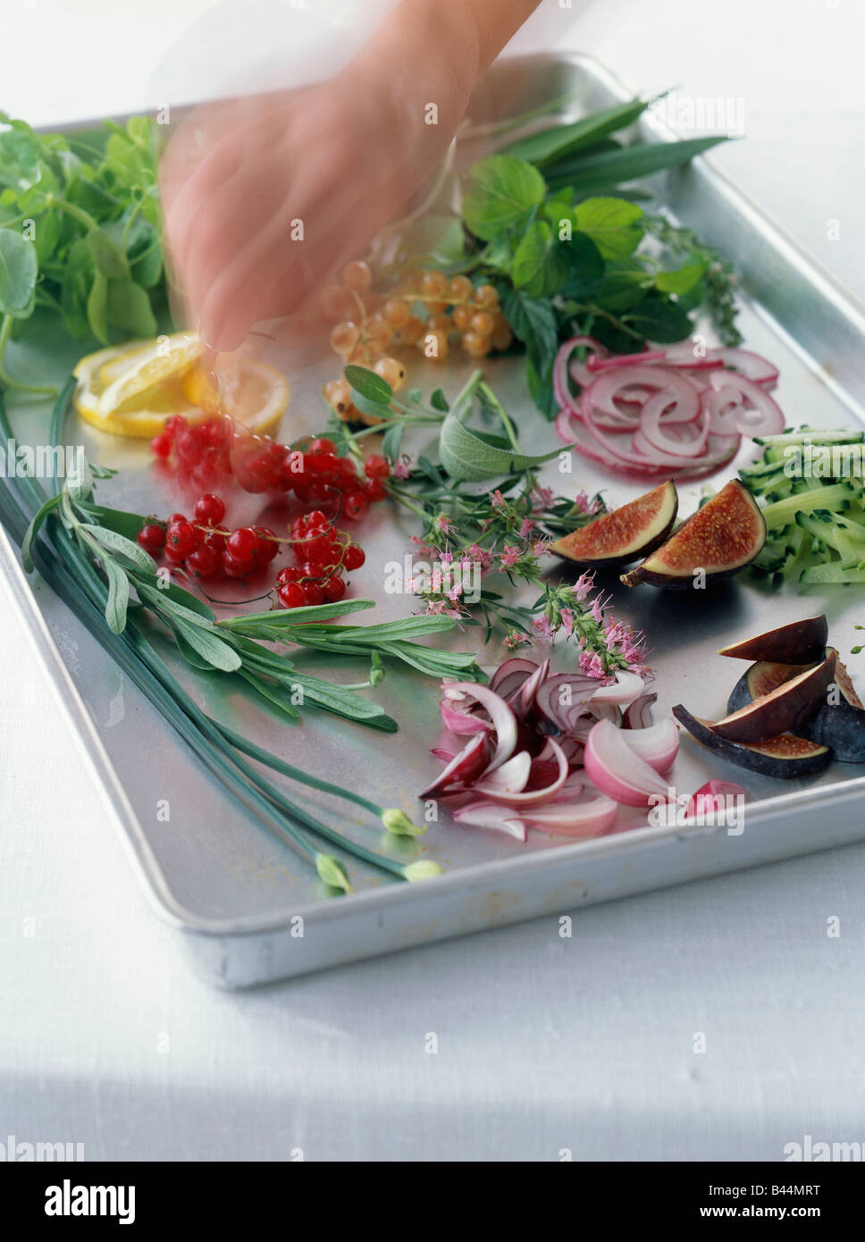 selection of herbs,figs and onions on a hot plate Stock Photo - Alamy