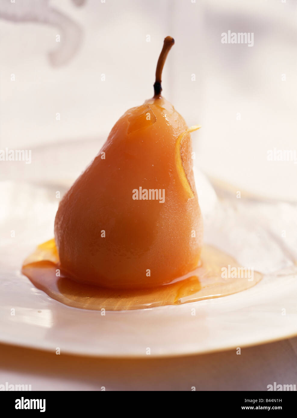Pear poached with orange Stock Photo - Alamy