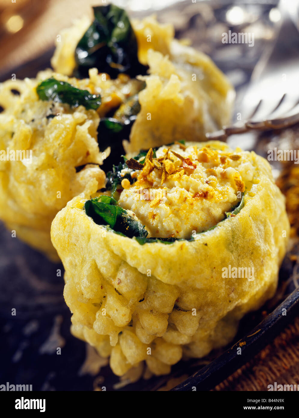 Spinach,brousse cheese and curry fritters Stock Photo - Alamy