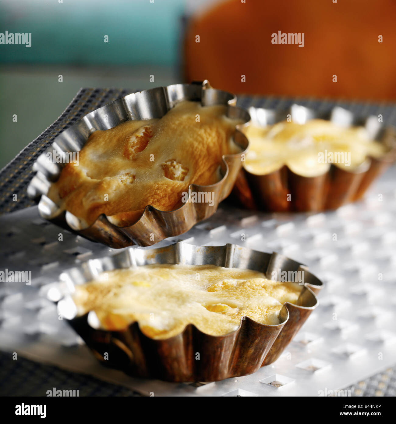 Small clementine and coconut mousse clafoutis Stock Photo - Alamy