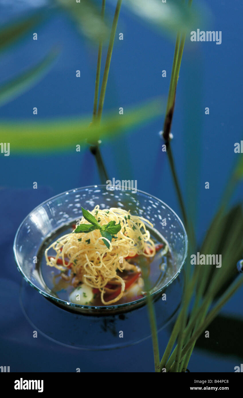 bowl of salad floating on water Stock Photo - Alamy
