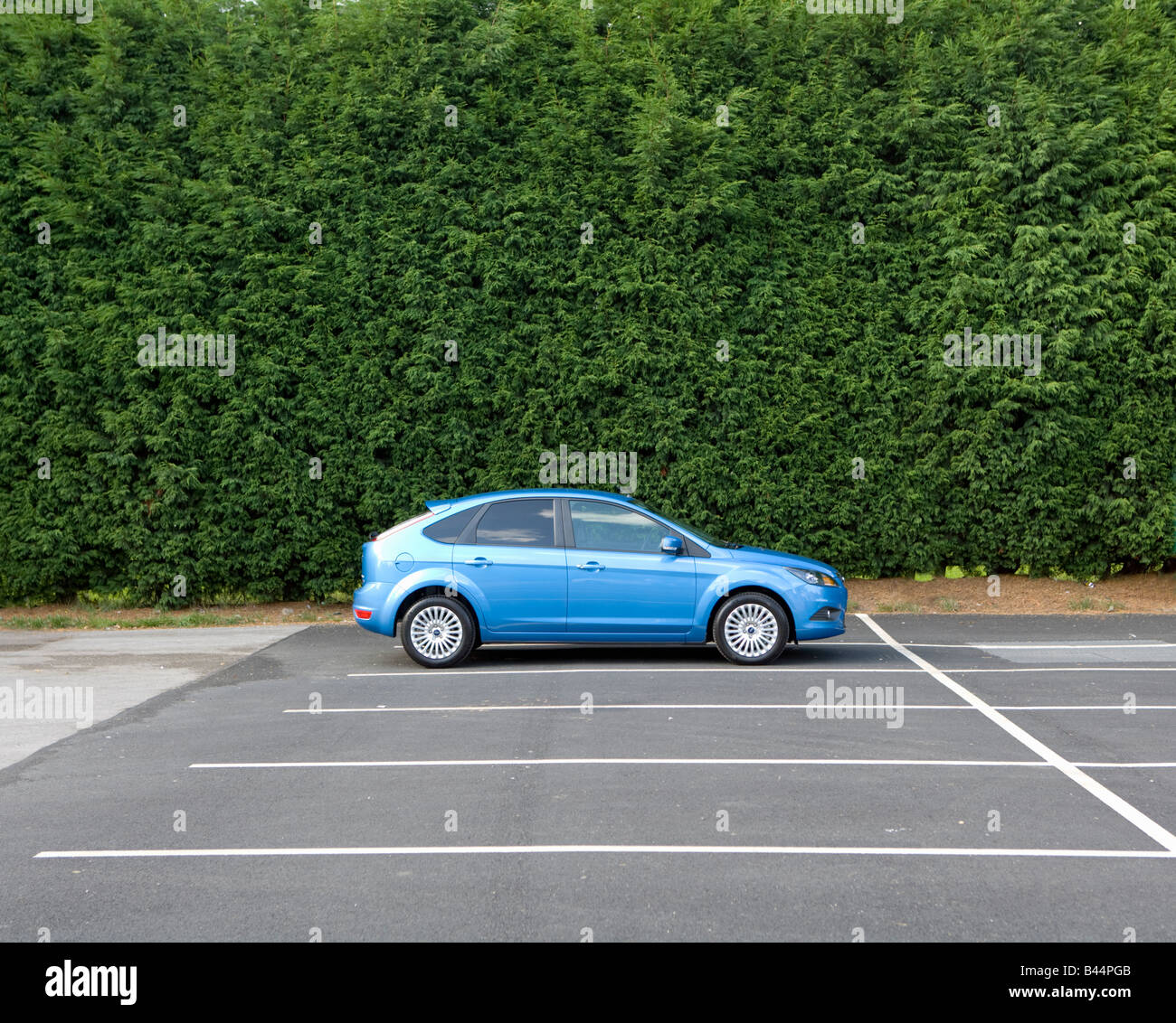 Lone car in car park Stock Photo - Alamy