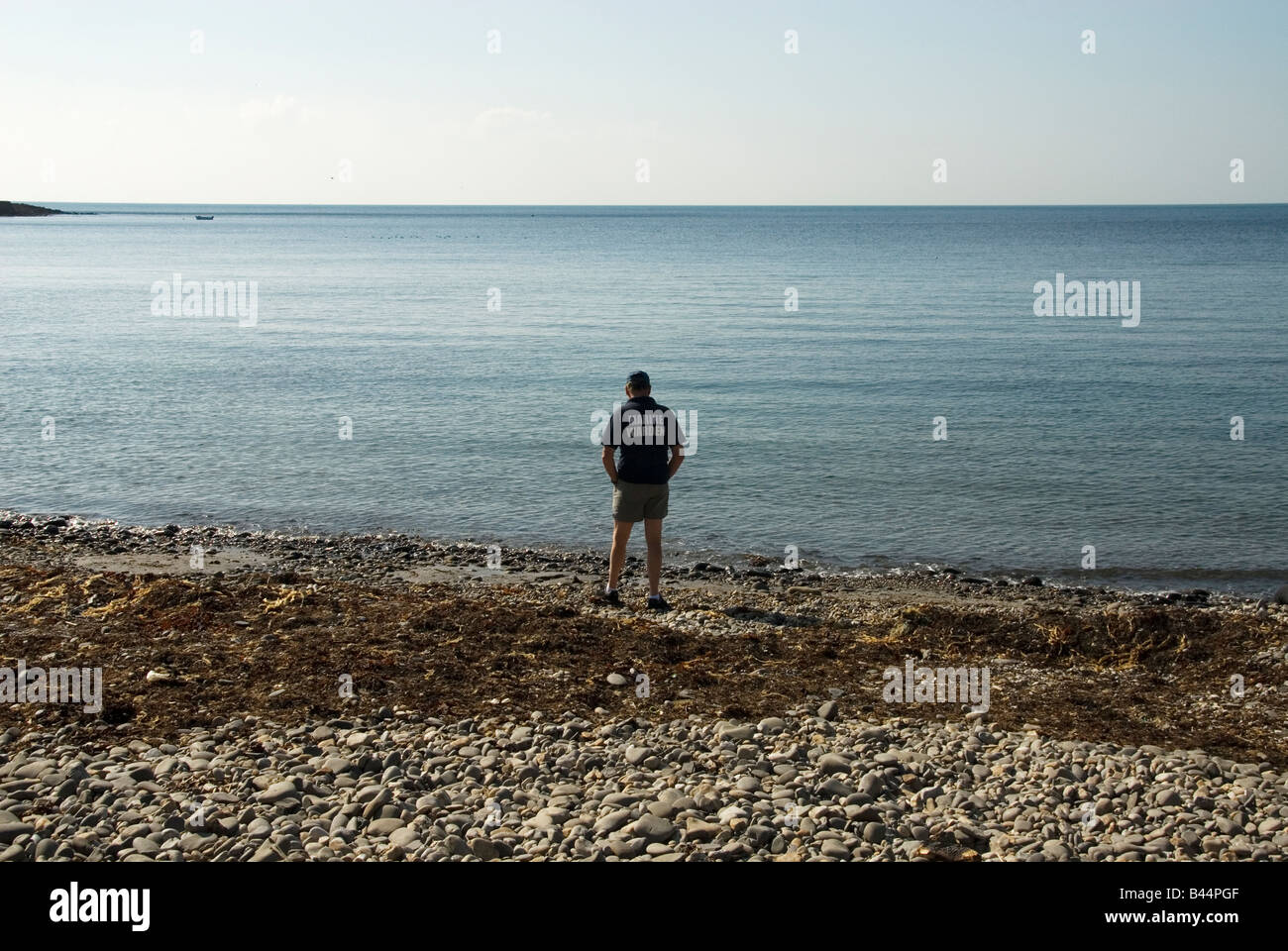 Kimmeridge Bay Dorset England Marine ranger patroling the beach Stock ...
